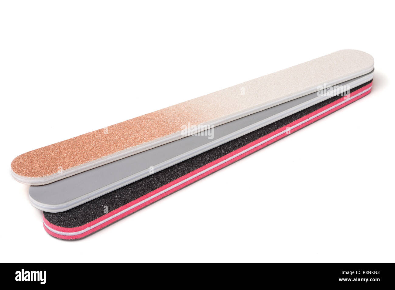 Three nail file with a different abrasive isolated on white background ...