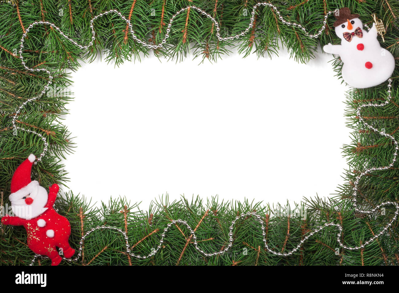 Christmas frame made of fir branches decorated with Santa Claus snowman ...