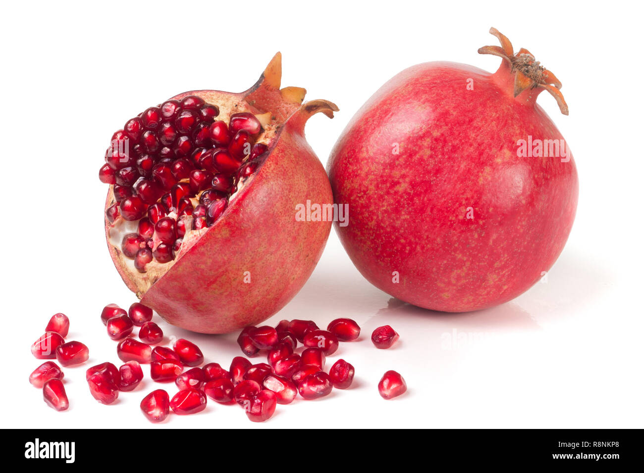 two pomegranate isolated on a white background Stock Photo - Alamy