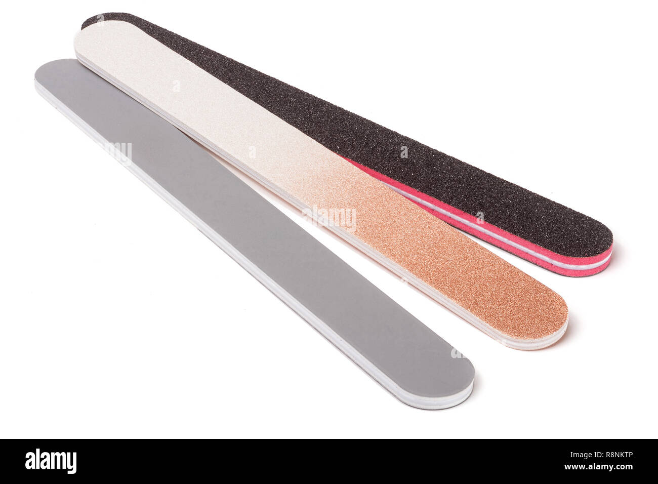 Three nail file with a different abrasive isolated on white background ...