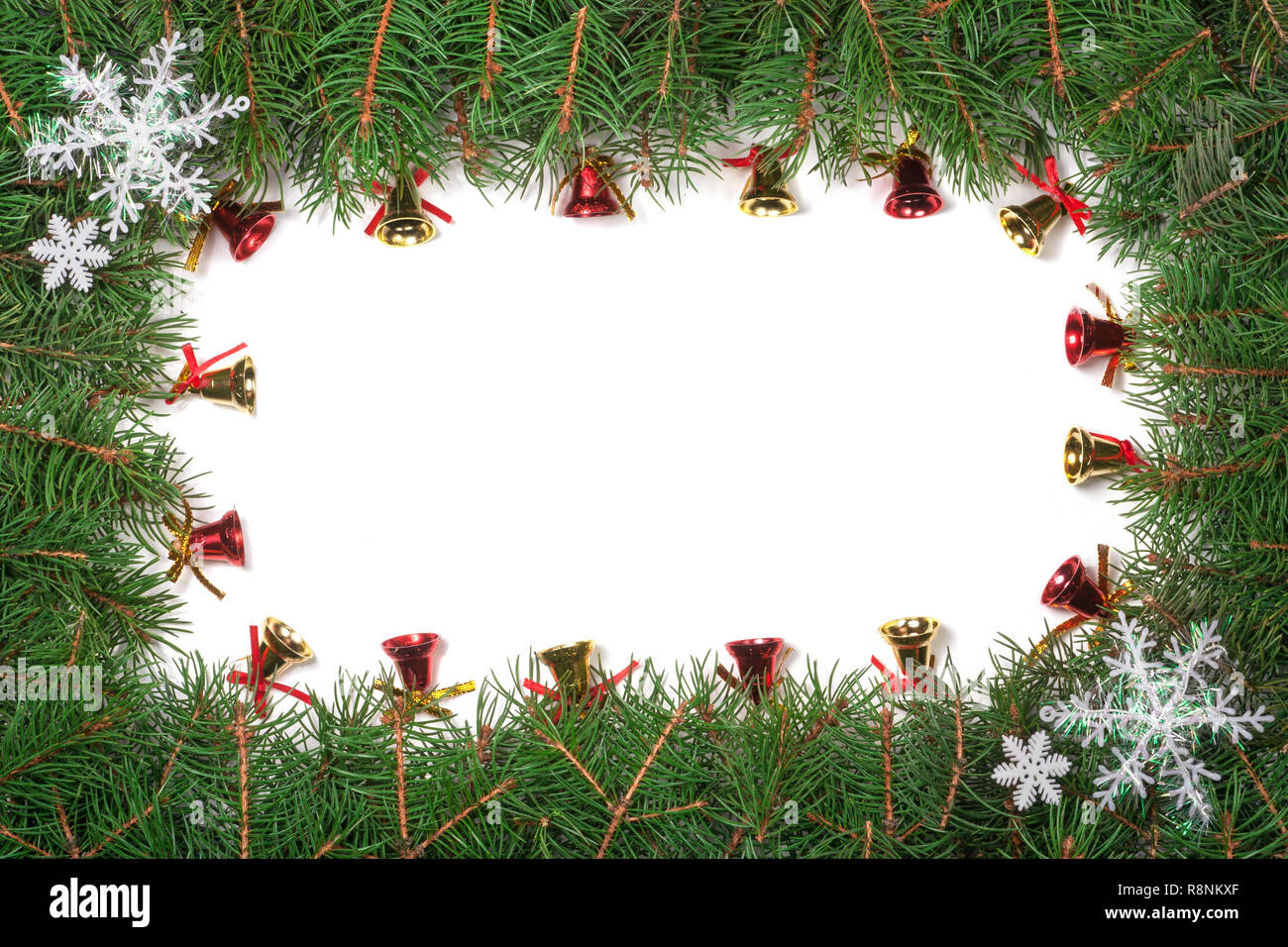 Christmas frame made of fir branches decorated with snowflakes and ...