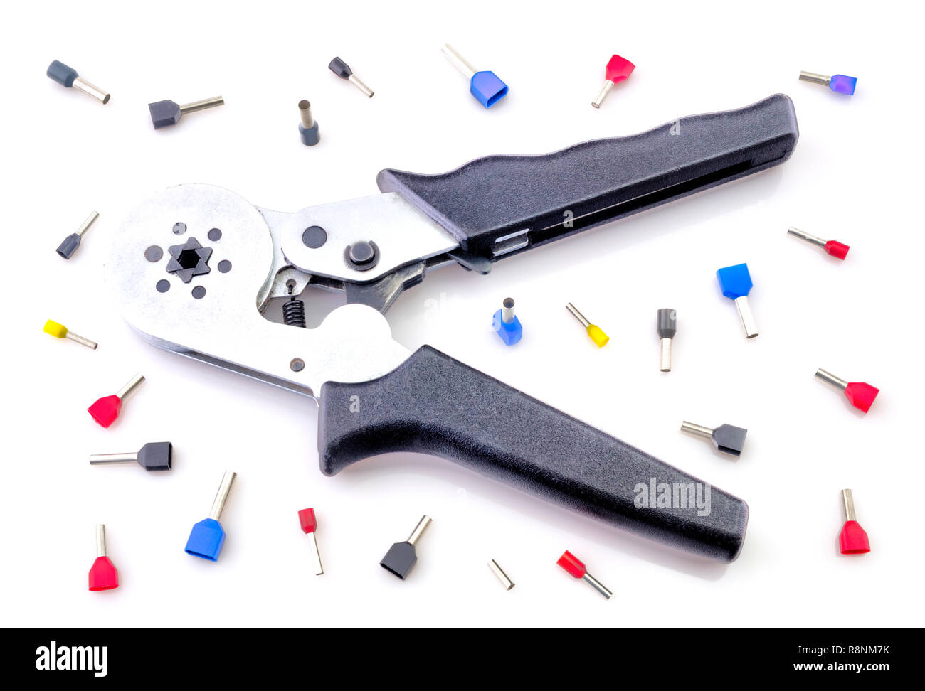 Crimping tool and electrical connectors isolated on white background ...