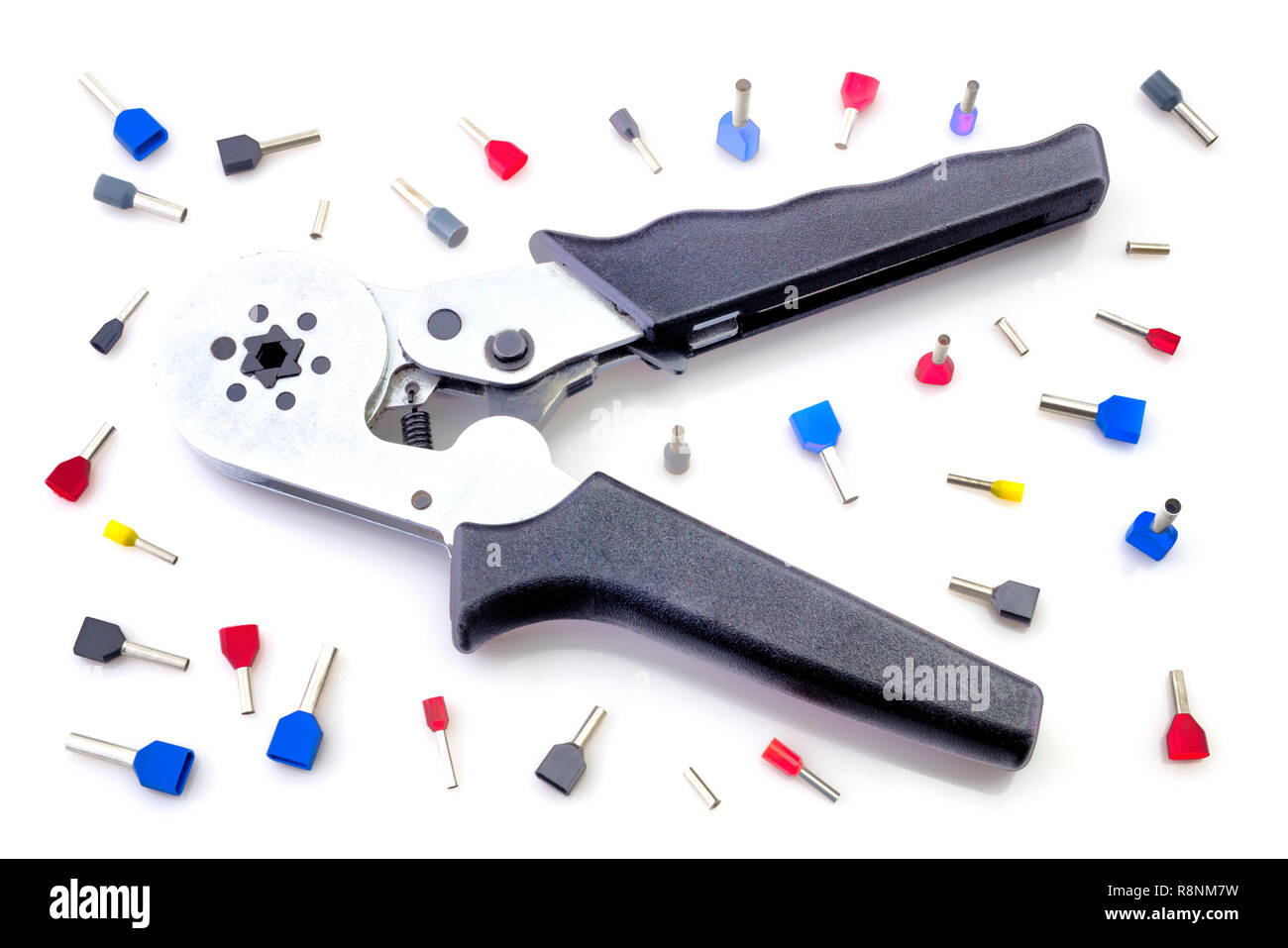 Crimping tool and electrical connectors isolated on white background ...