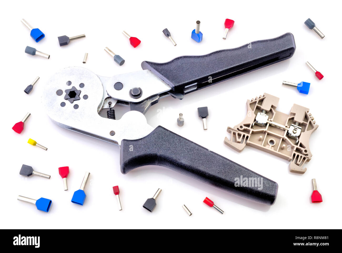 Crimping tool and electrical connectors isolated on white background ...