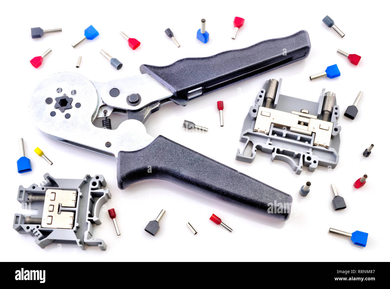 Crimping tool and electrical connectors isolated on white background ...