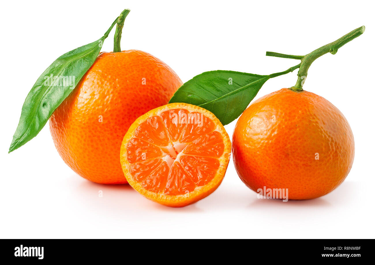 Two mandarin and half on a white background Stock Photo - Alamy