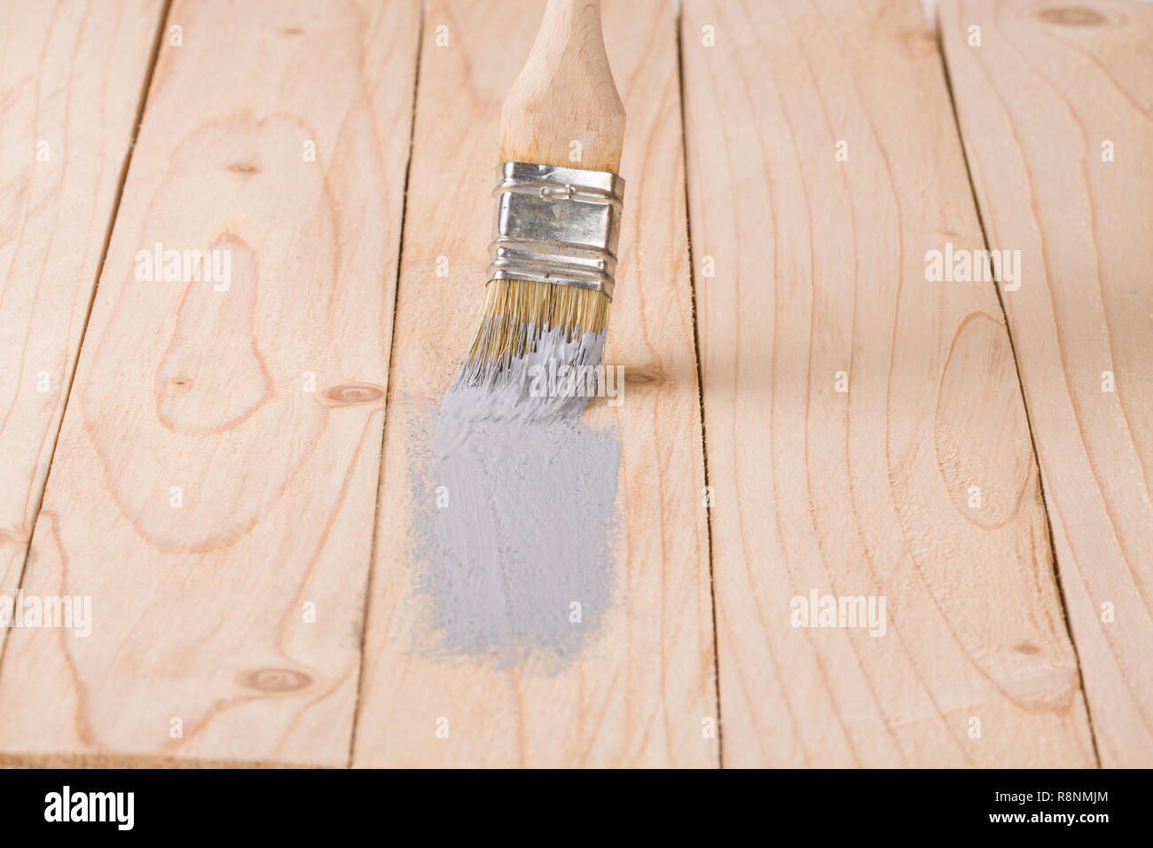 painting wooden board paint brush gray color Stock Photo - Alamy