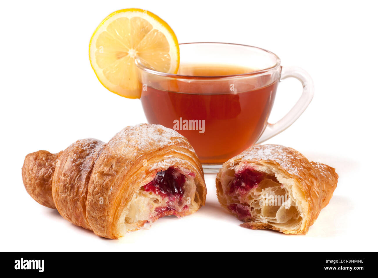 croissant with a cup of tea isolated on white background closeup Stock ...