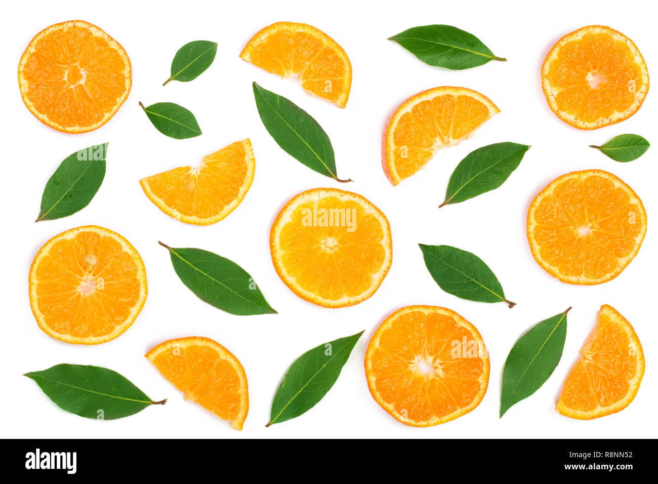 Slices of orange or tangerine with leaves isolated on white background. Flat lay, top view ...