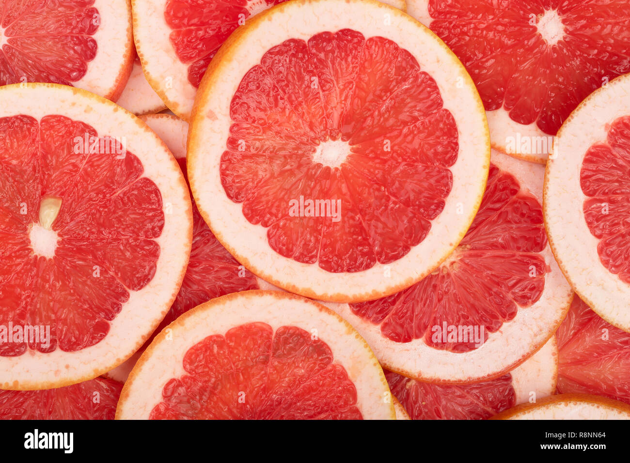 Grapefruit slices as background. Top view. Flat lay pattern Stock Photo - Alamy