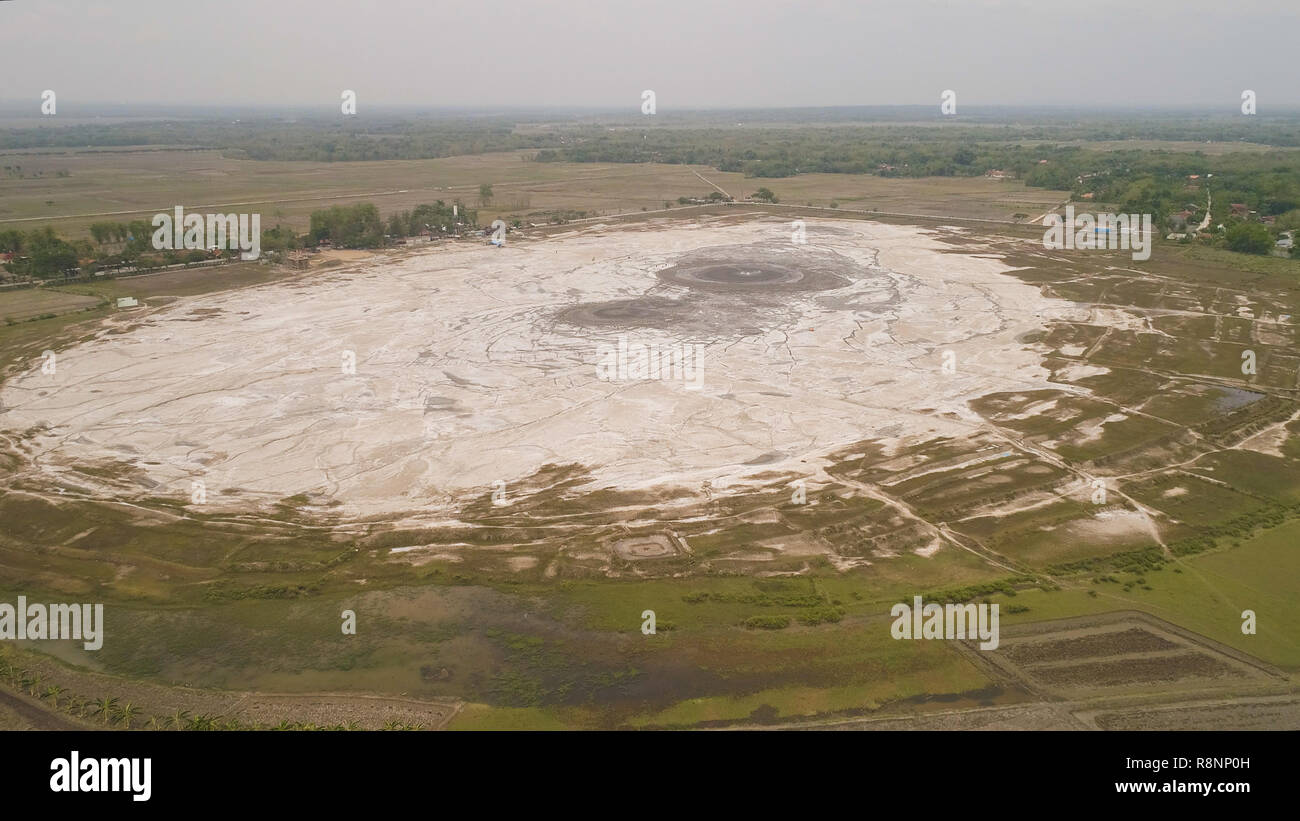 Mud volcano bledug kuwu. aerial view volcanic plateau with geothermal ...