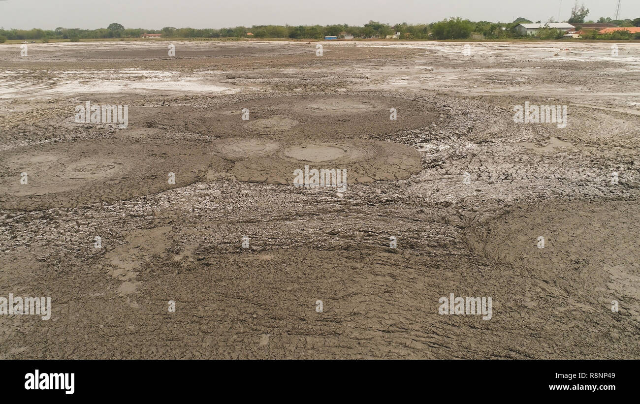 Mud volcano bledug kuwu. aerial view volcanic plateau with geothermal ...