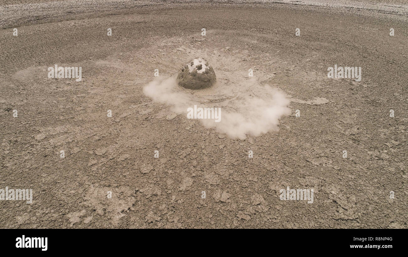 Mud volcano with bursting bubble bledug kuwu. aerial view volcanic ...