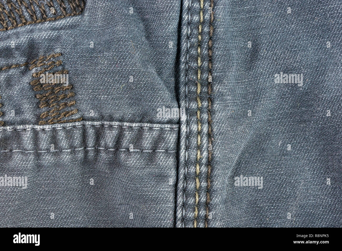 clothing items washed cotton fabric texture with seams, macro, close-up ...