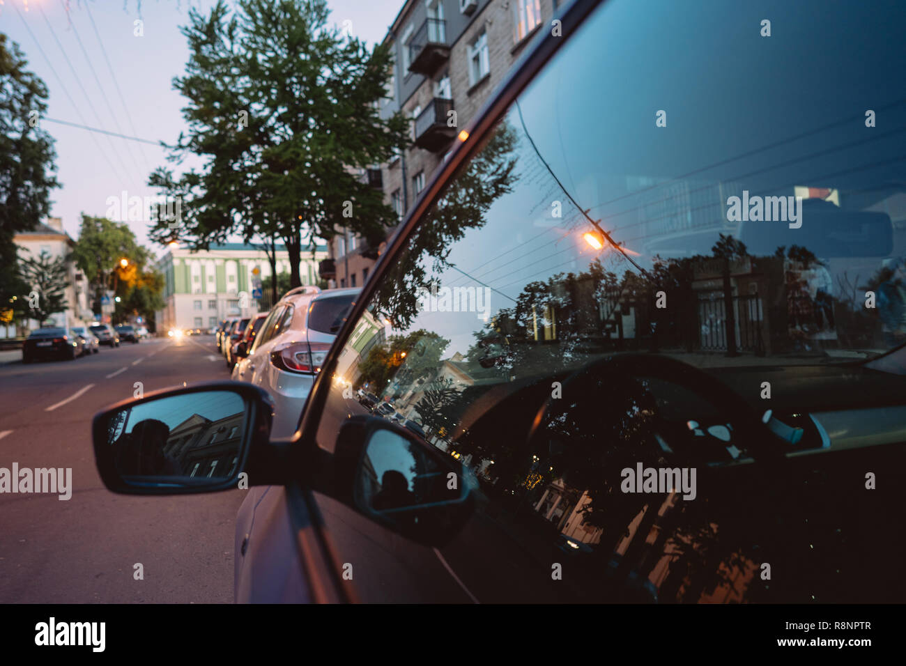 The side mirror and the window reflect the street Stock Photo - Alamy