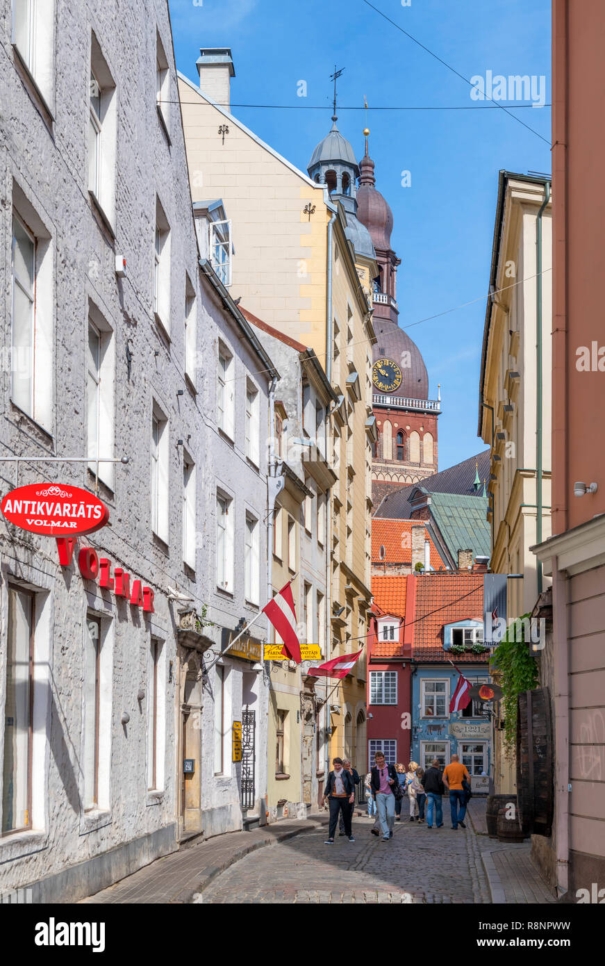 Street in the historic old town with the Cathedral tower in the ...