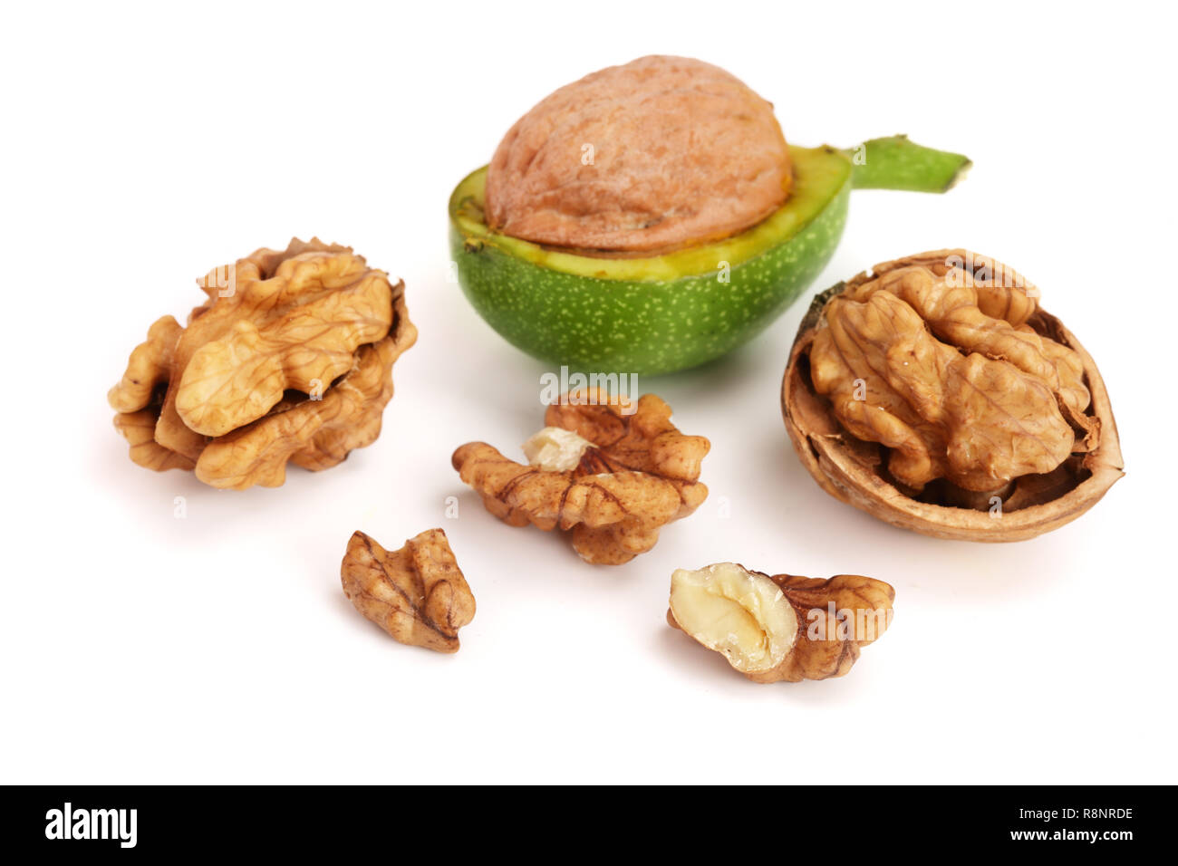fresh walnuts in peel isolated on white background Stock Photo - Alamy