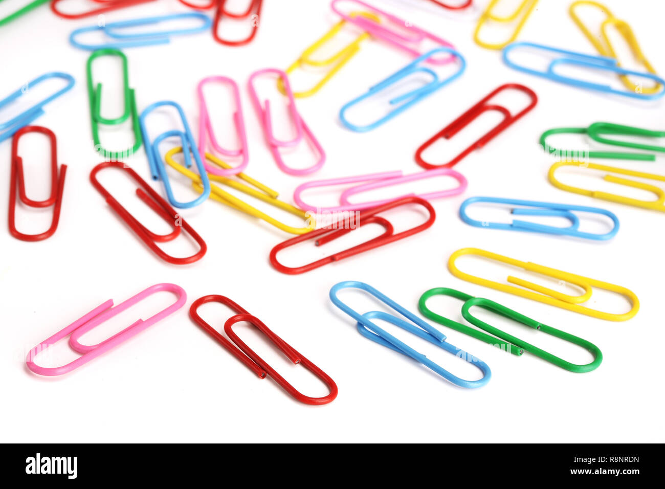 colorful paper clips isolated on white background Stock Photo - Alamy