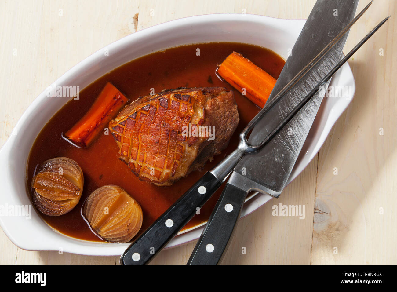 bavarian pork meat in a baking dish Stock Photo - Alamy