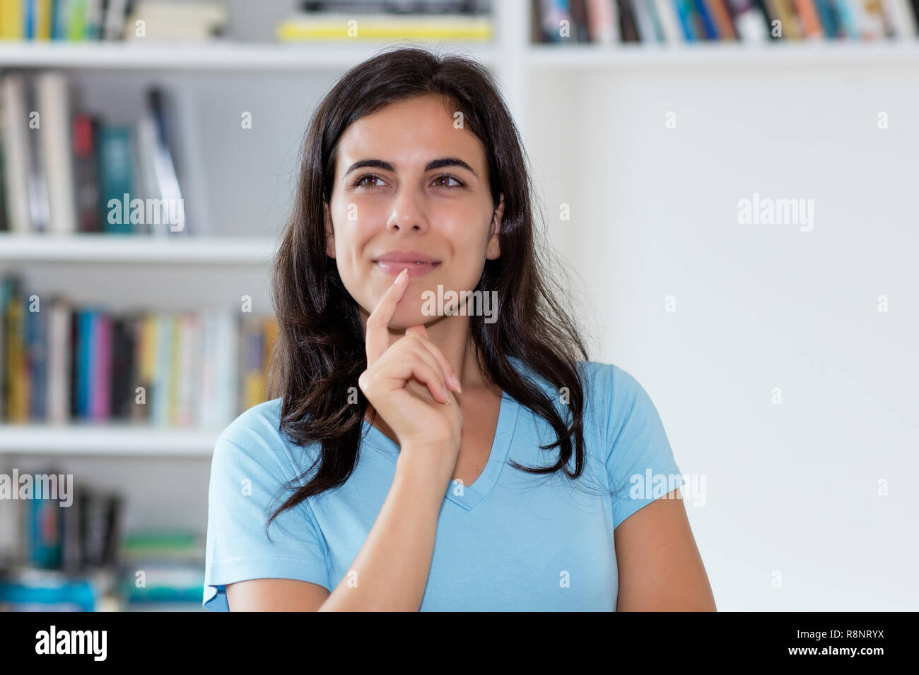 Thinking arabic woman with long dark hair indoor at home Stock Photo ...