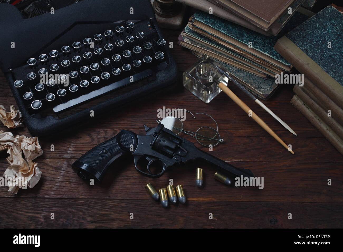 Writing a detective story - old retro vintage typewriter and revolver ...