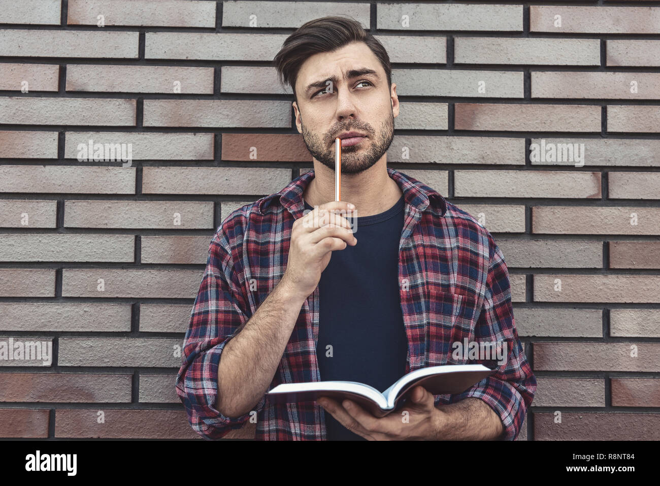 Man standing up reading a book hi-res stock photography and images - Alamy