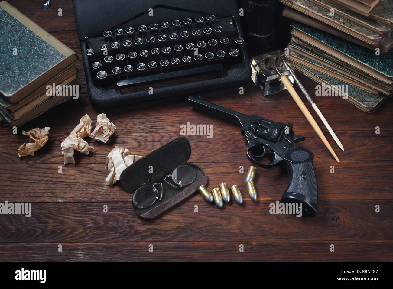 Writing a detective story - old retro vintage typewriter and revolver ...