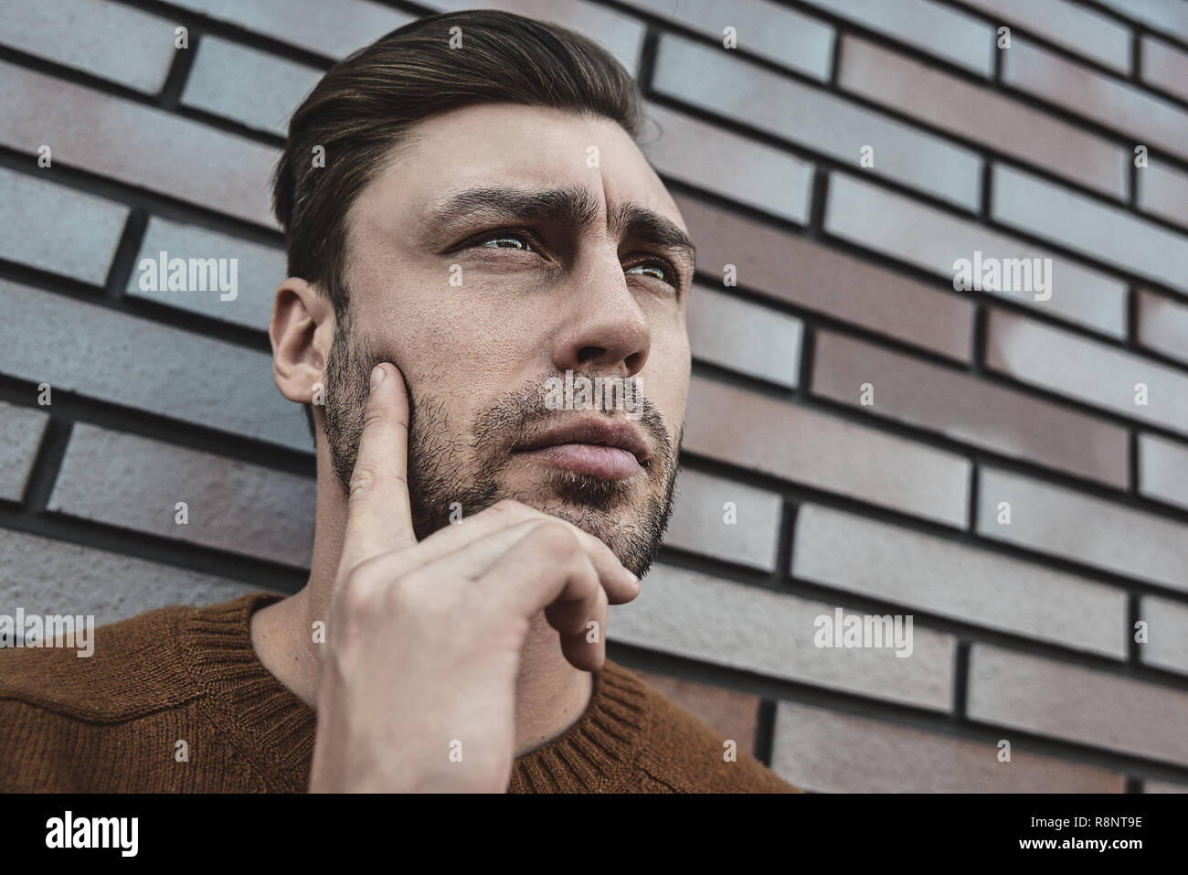 Portrait of handsome serious man thinking about something isolated on ...