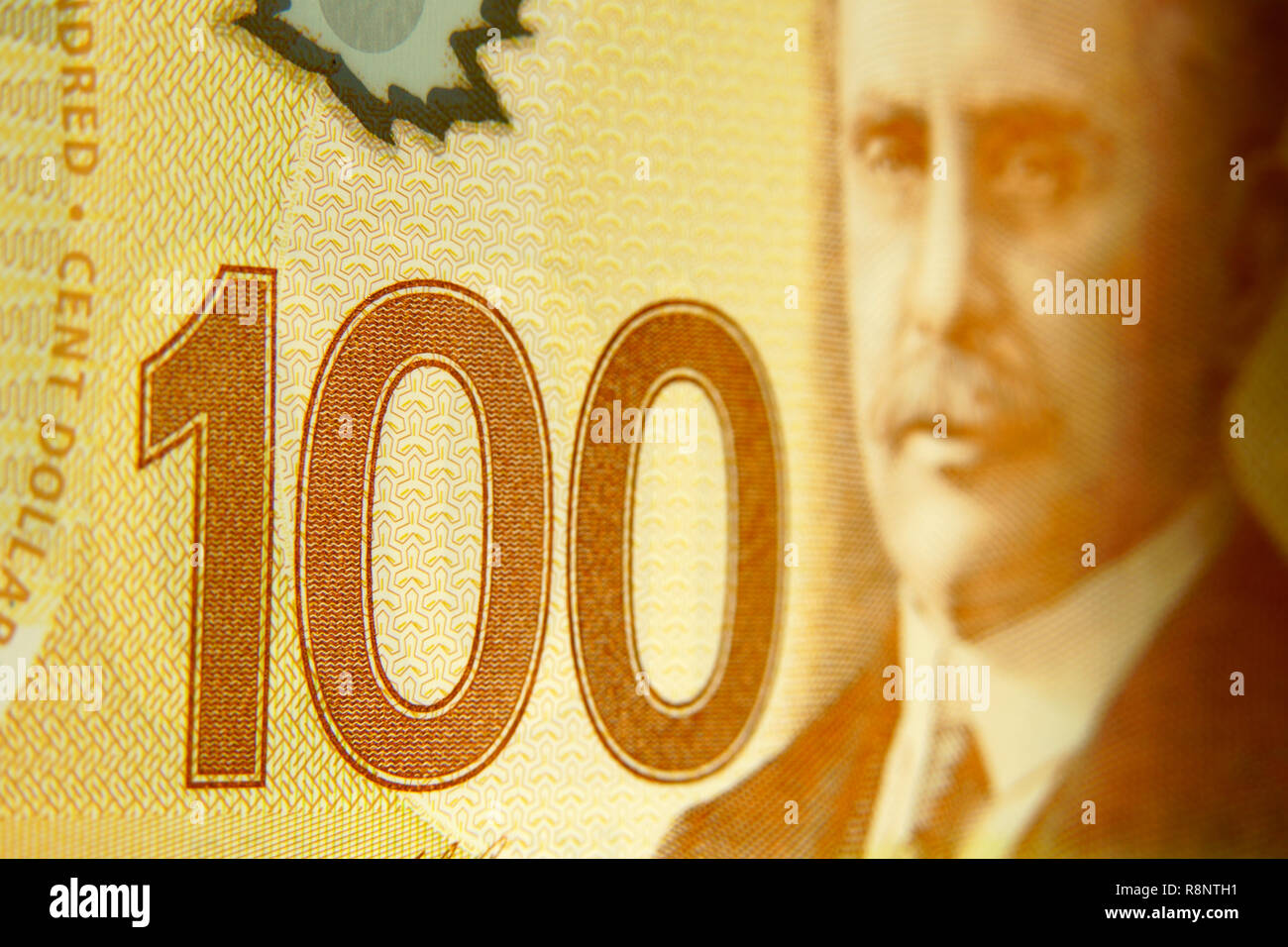 Close up of a one hundred canadian dollar bill with the portrait of Sir Robert L. Borden, prime ...