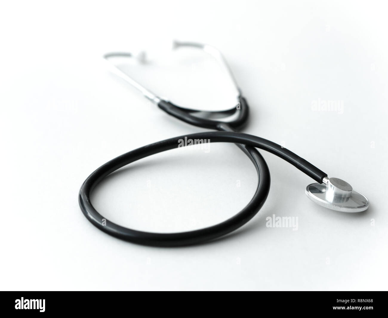 A doctors black flexible rubber and steel metal heart pulse stethoscope ...
