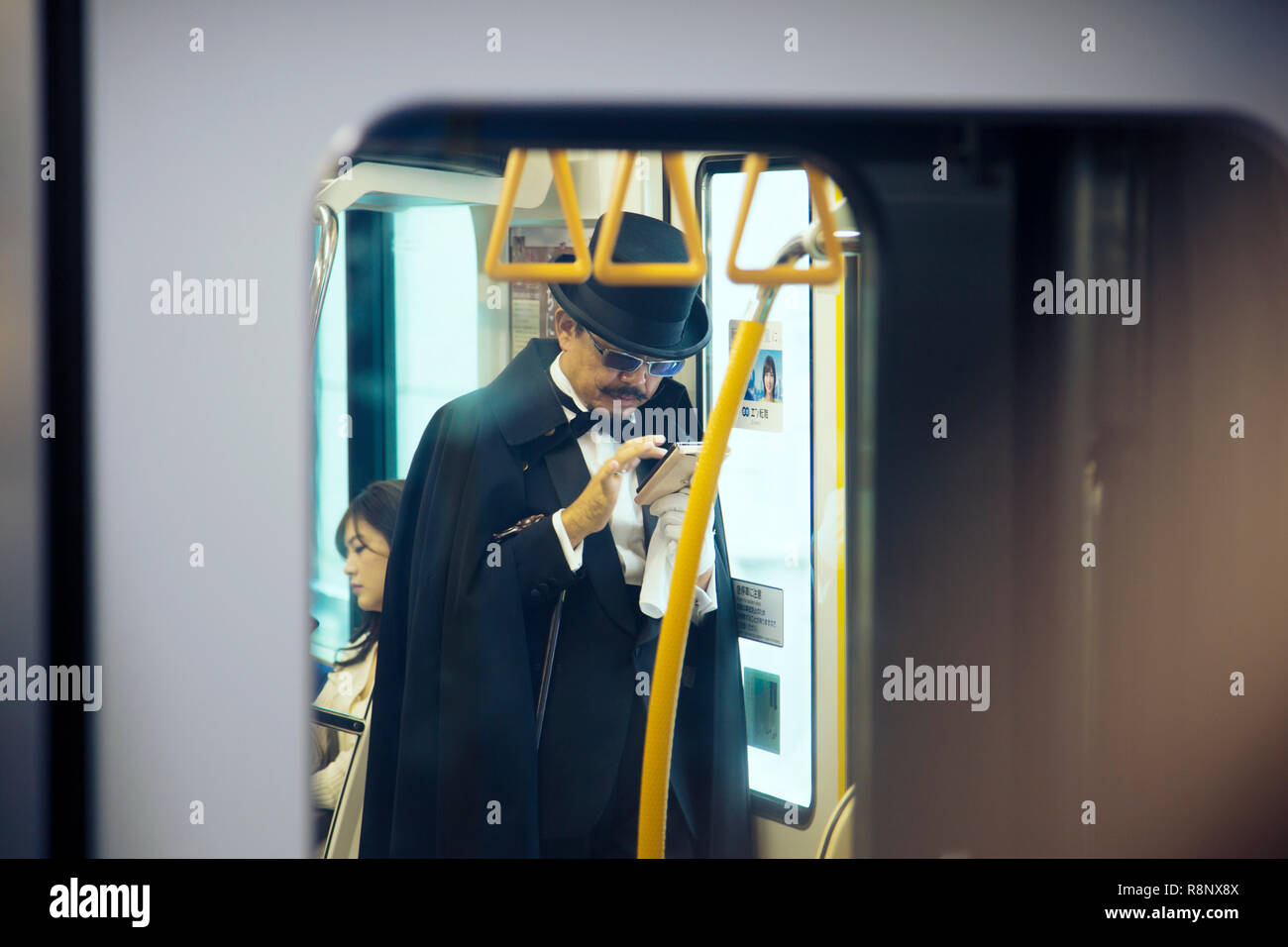A very stylish Japanese gentleman on the subway at Shinjuku, Tokyo ...
