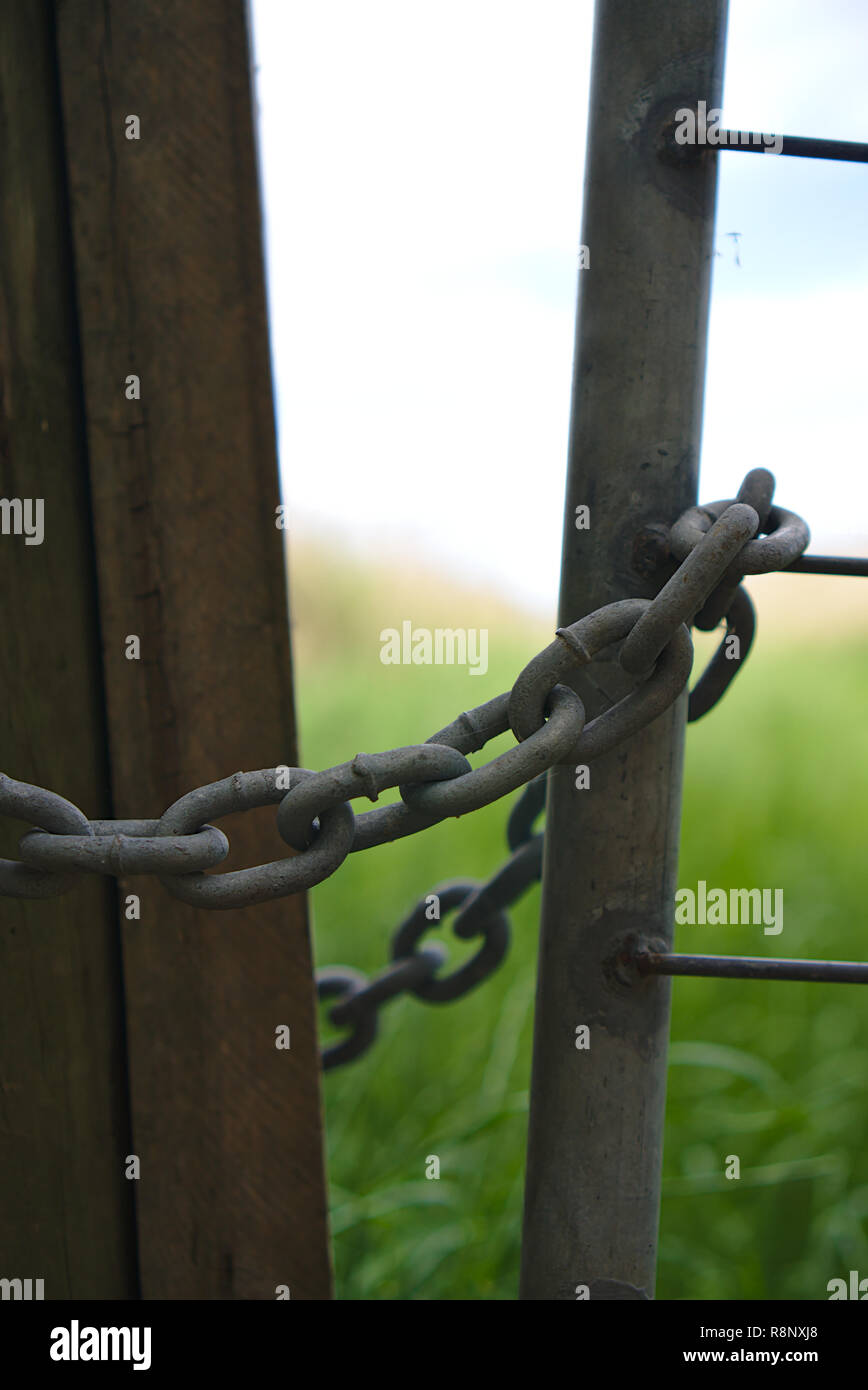 Close up view of chains on gate Stock Photo - Alamy