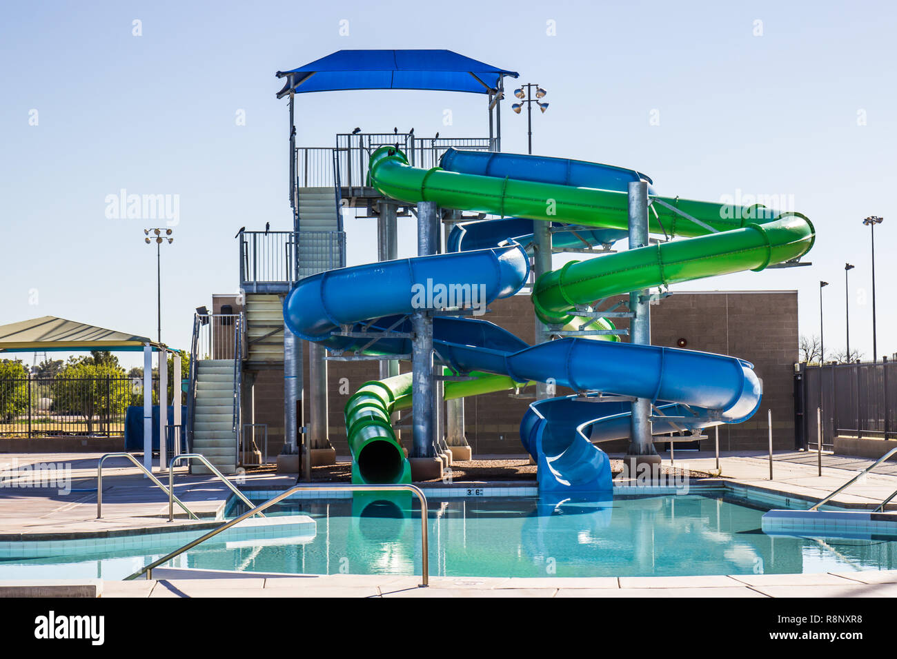 Blue And Green Tube Slides At Swimming Complex In Early Morning Stock ...