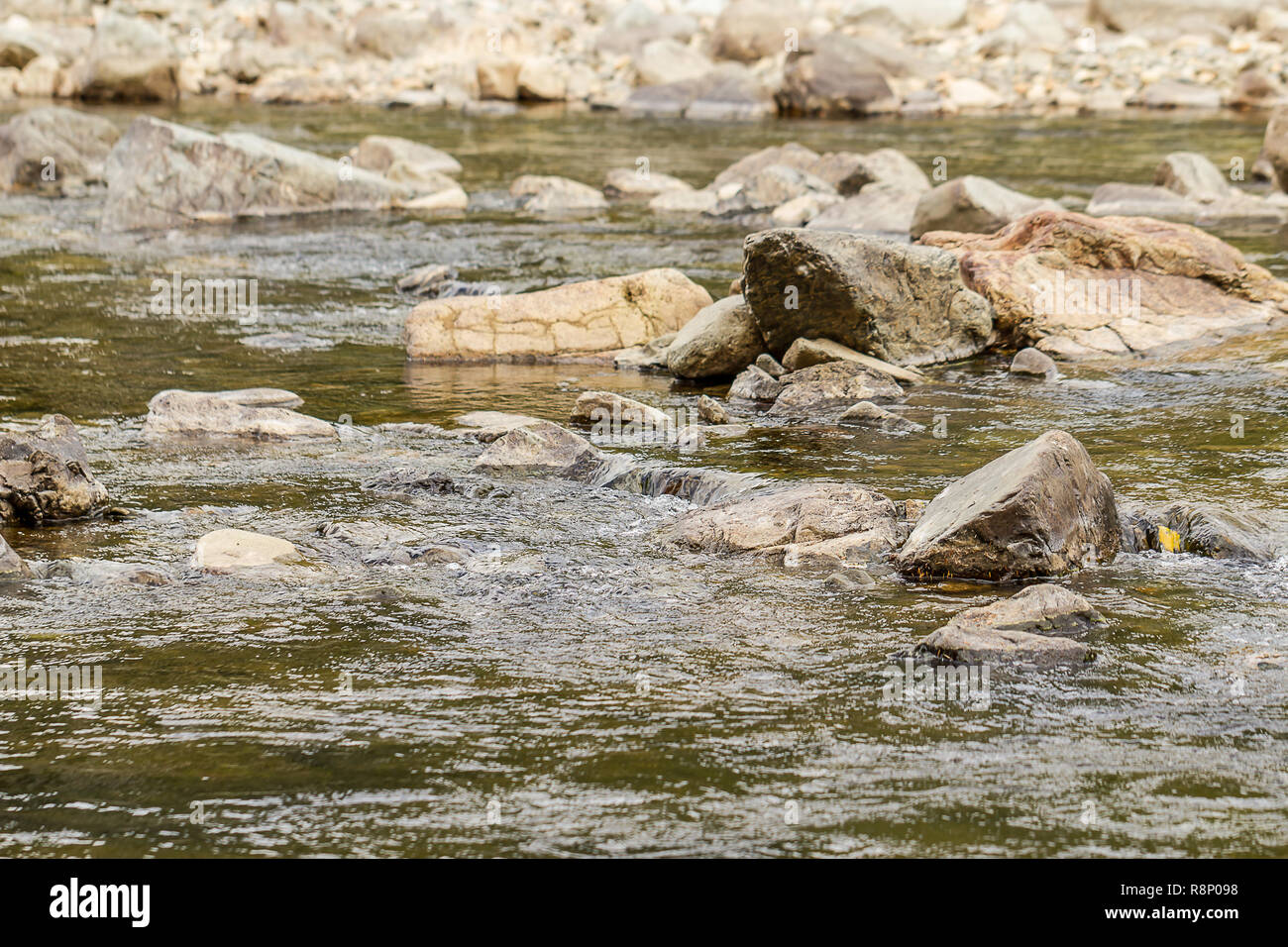 harsh hard stone with water running through them Stock Photo - Alamy