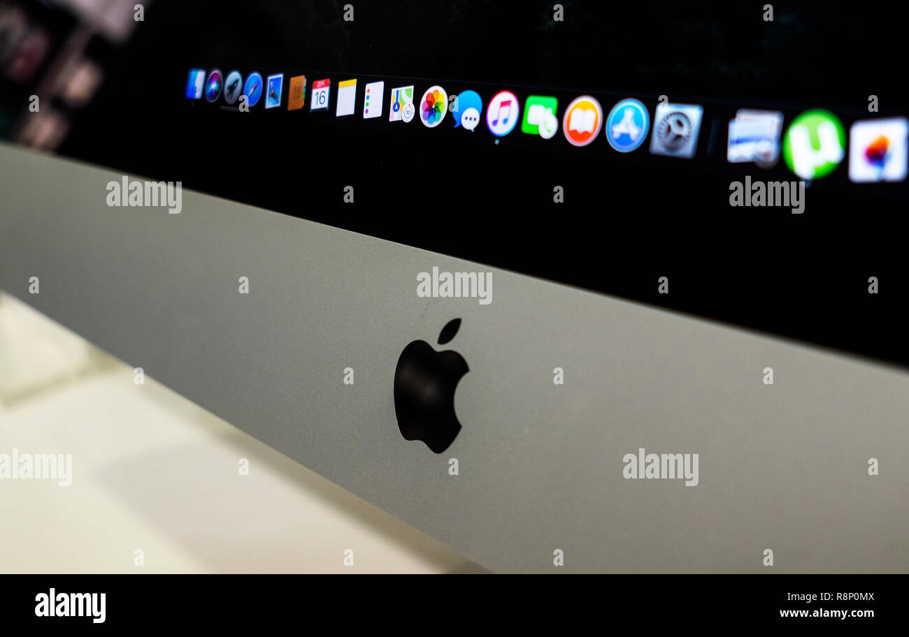 Apple computer logo on grey steel frame of imac desktop computer ...