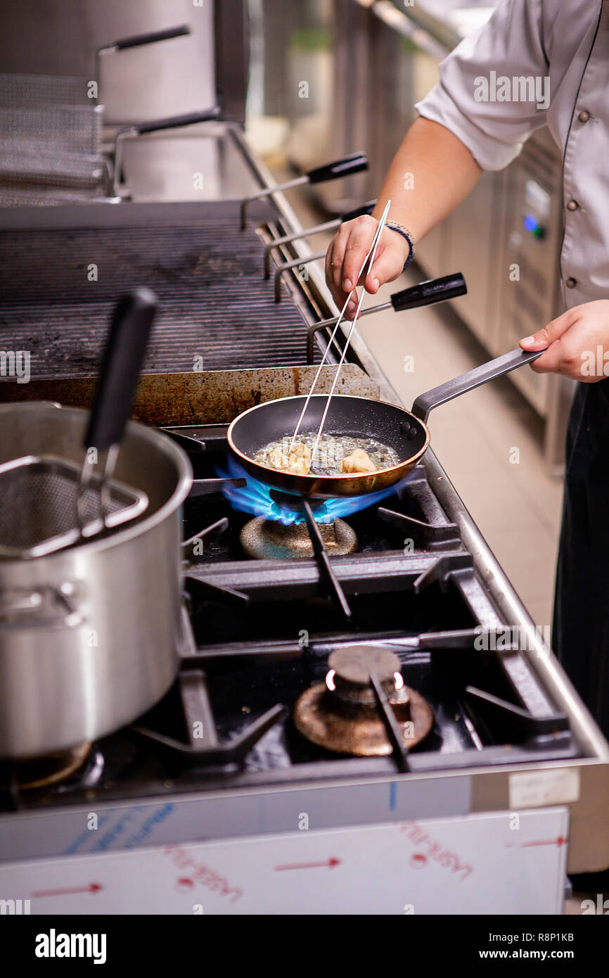 Chef fries fois gras in stove, Cook making delicious food Stock Photo ...