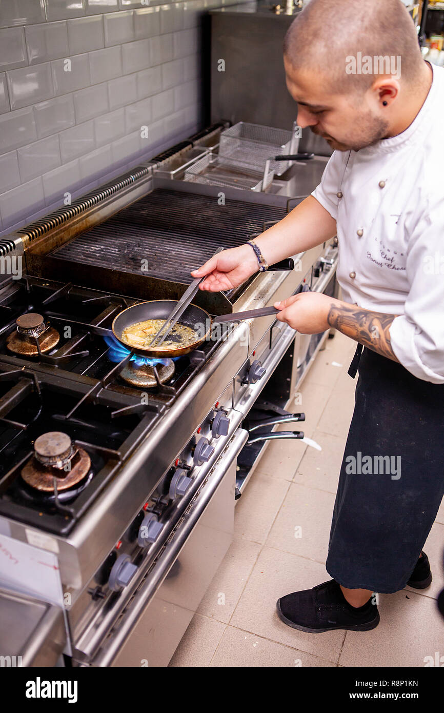 Chef fries fois gras in stove, Cook making delicious food Stock Photo ...