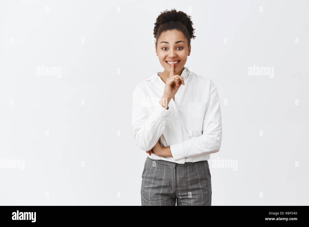 Shhh, no words please. Portrait of charming friendly-looking dark ...