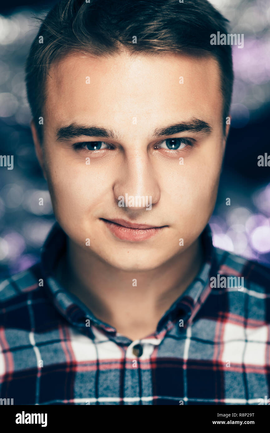 portrait of a young man on a blurred background Stock Photo - Alamy