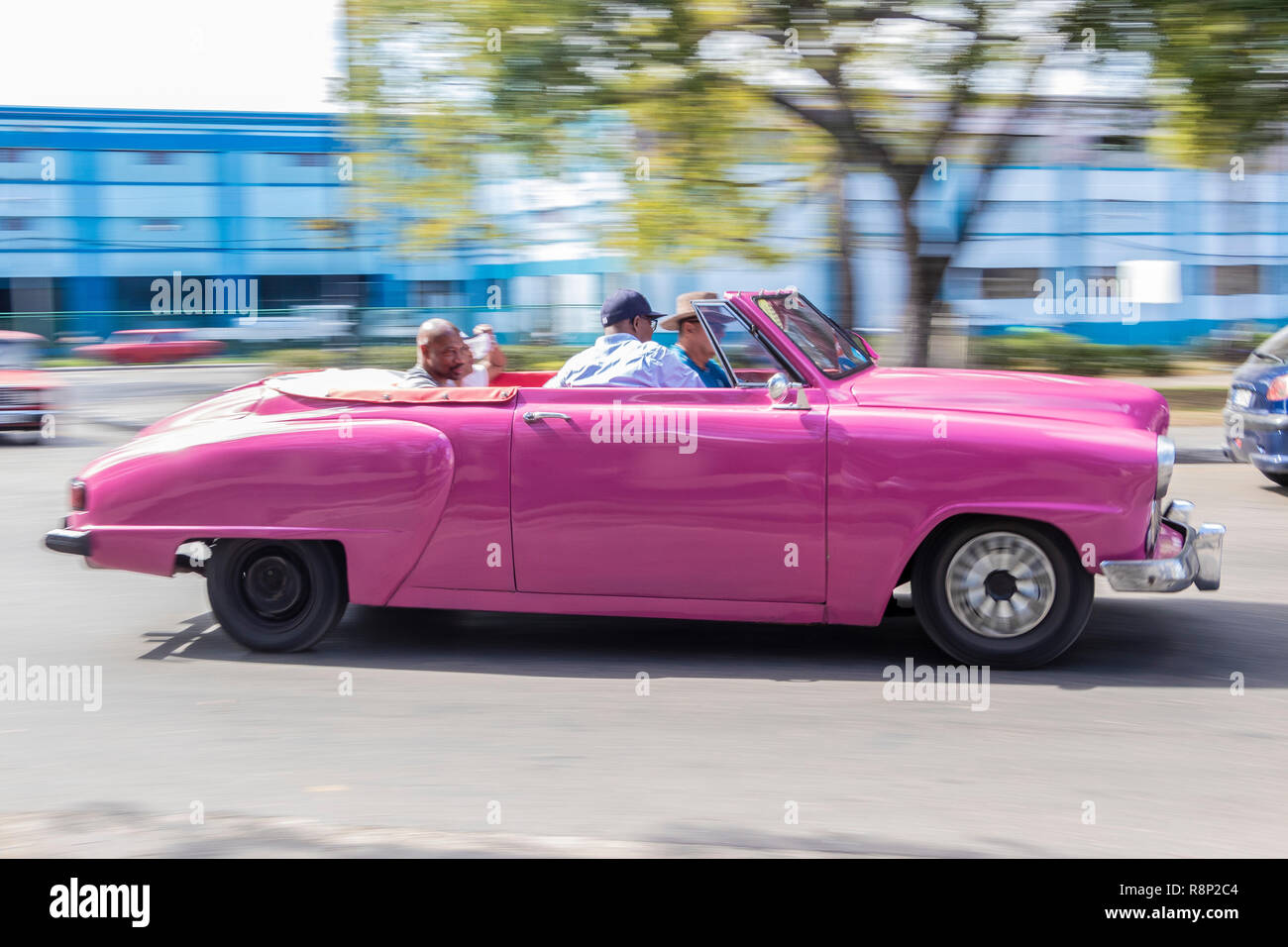 vintage American 1950s car driving at speed with blurred background in ...