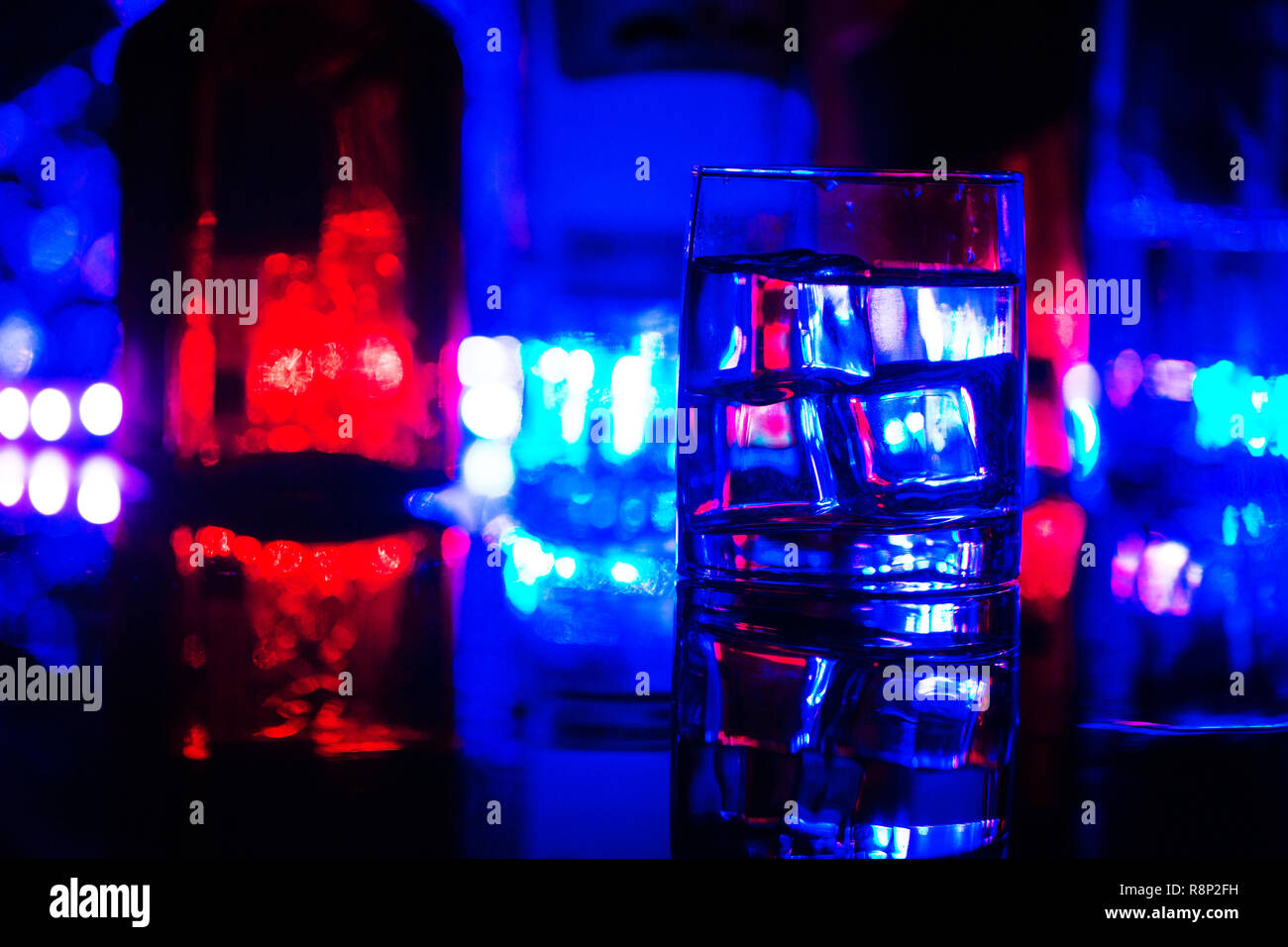 colored lighting of glasses in the night club bar Stock Photo - Alamy