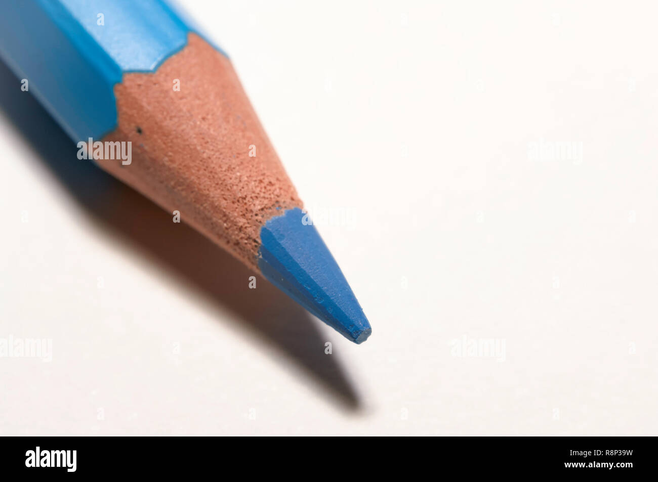 Macro of a blue color pencil, isolated on white paper Stock Photo - Alamy