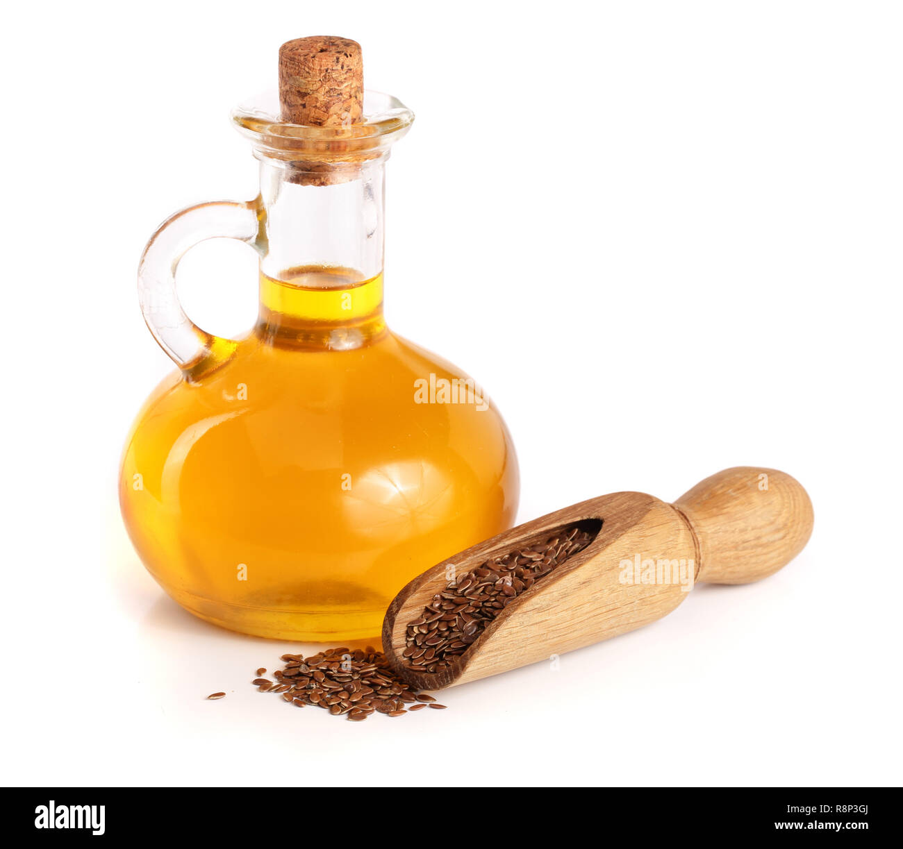 linseed oil with flax seeds isolated on white background Stock Photo ...