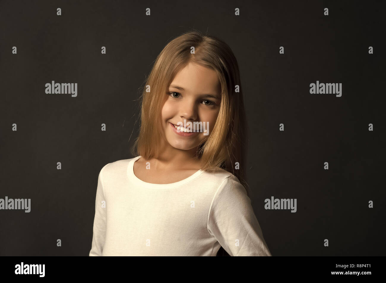 Beauty, look, hairstyle. Happy child, childhood concept. Girl with ...