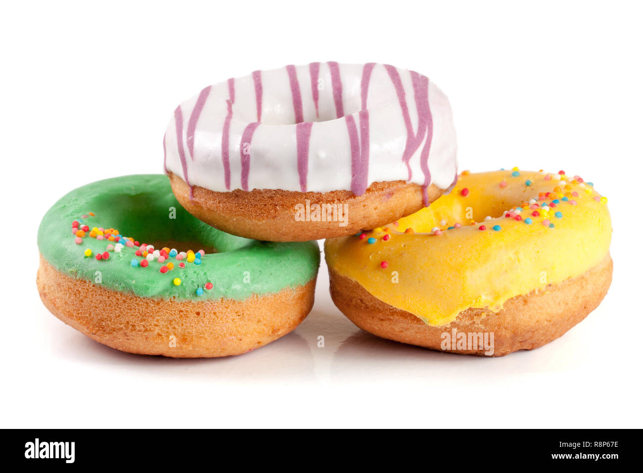 three glazed donuts isolated on white background Stock Photo - Alamy