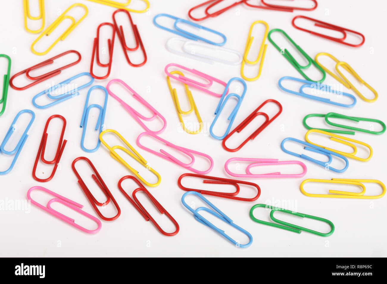 colorful paper clips isolated on white background Stock Photo - Alamy