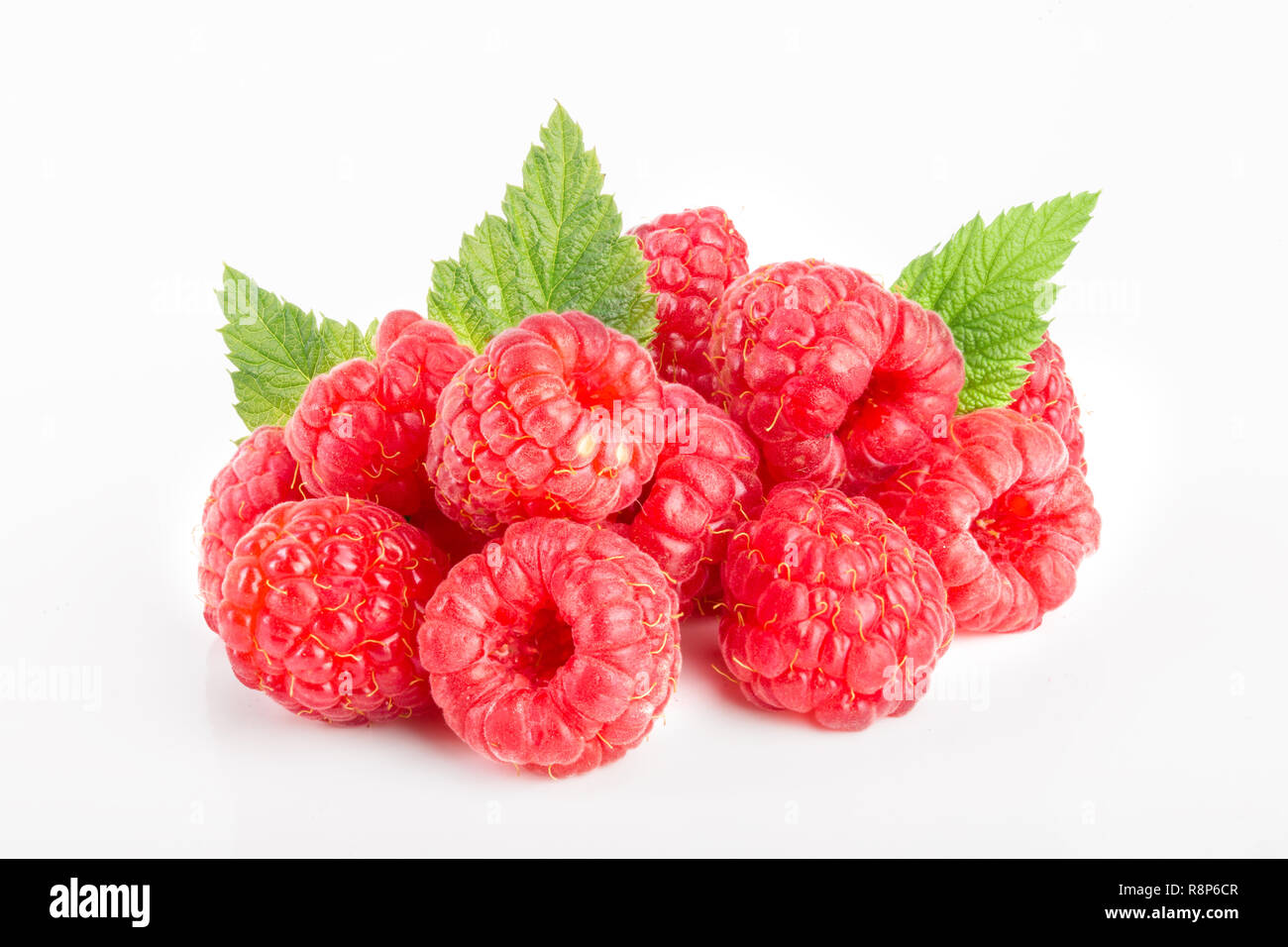 Raspberry isolated on white background. Pile or heap Stock Photo - Alamy
