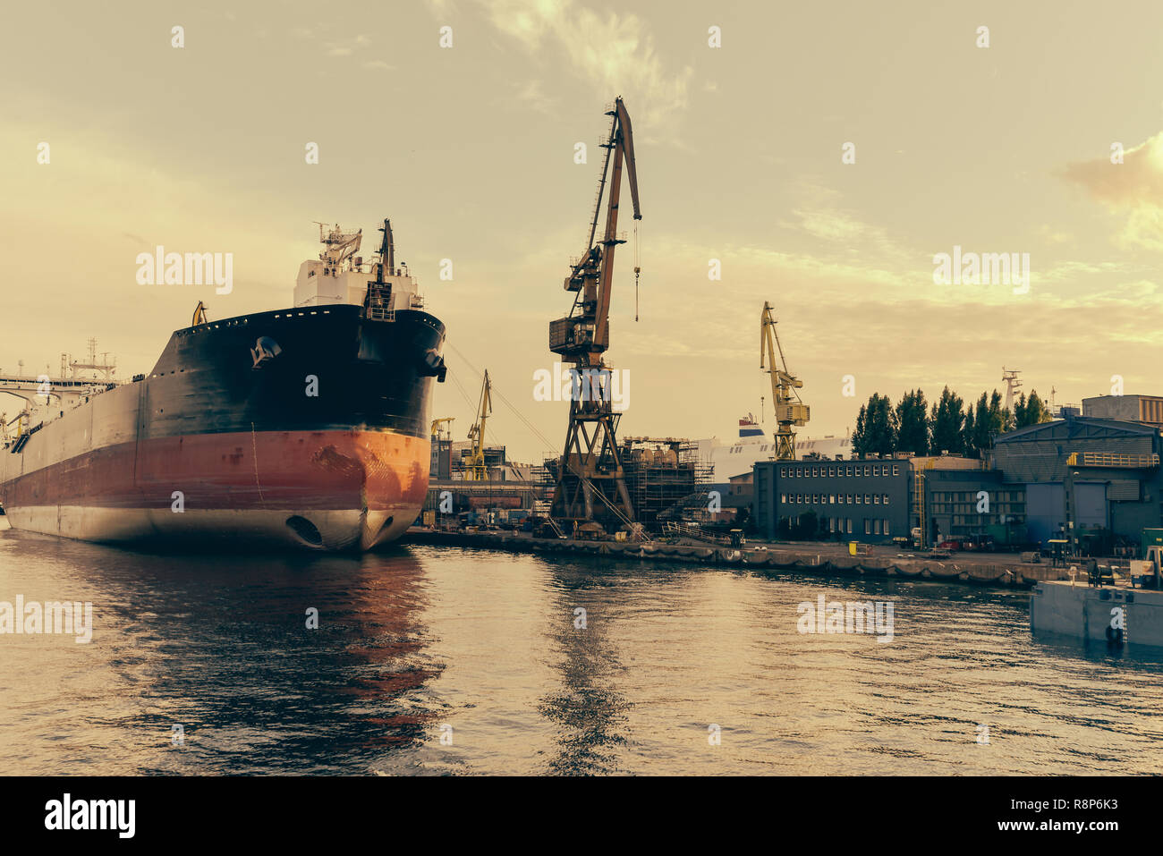 Big container cranes in the port of Gdansk, Poland in different scenery ...