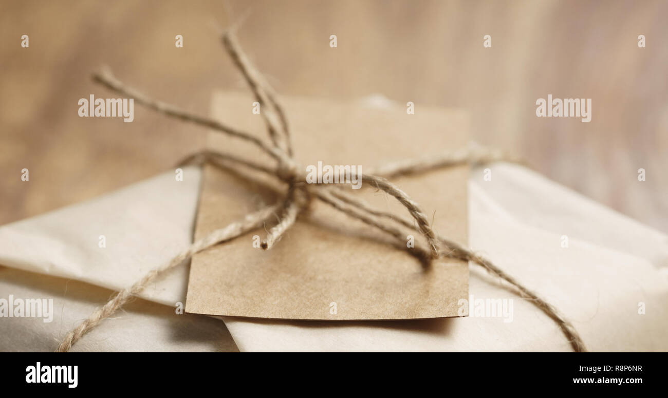 Closeup of chocolate wrapped with paper as a gift on wood table Stock ...