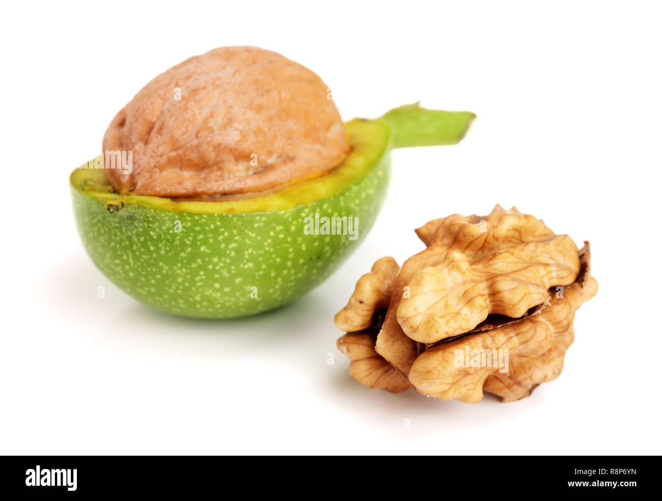 fresh walnuts in peel isolated on white background Stock Photo - Alamy